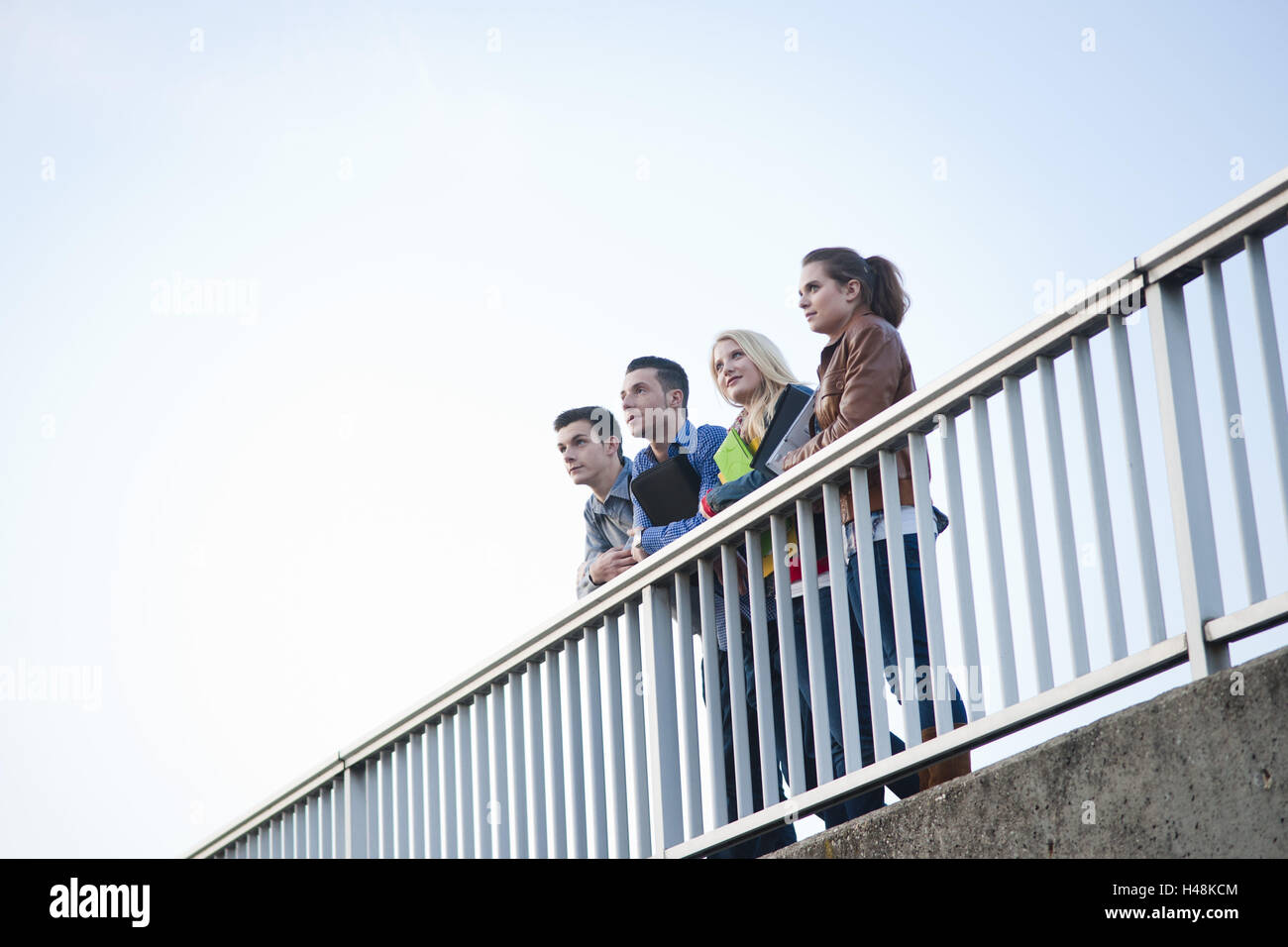Group, men, women, stand, bridge Stock Photo - Alamy
