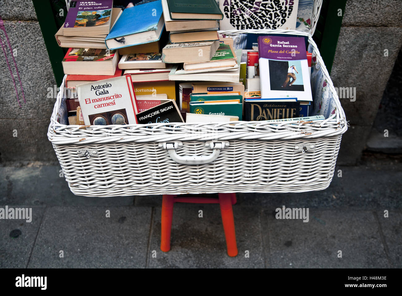 Basket, books, bookstore in the Malasana area, city centre, Madrid ...