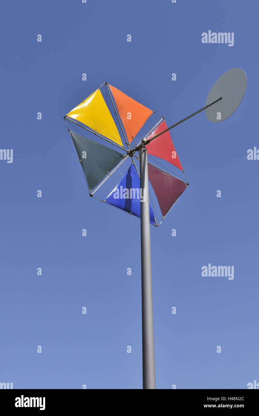Wind turbine, colourful, blue sky Stock Photo - Alamy