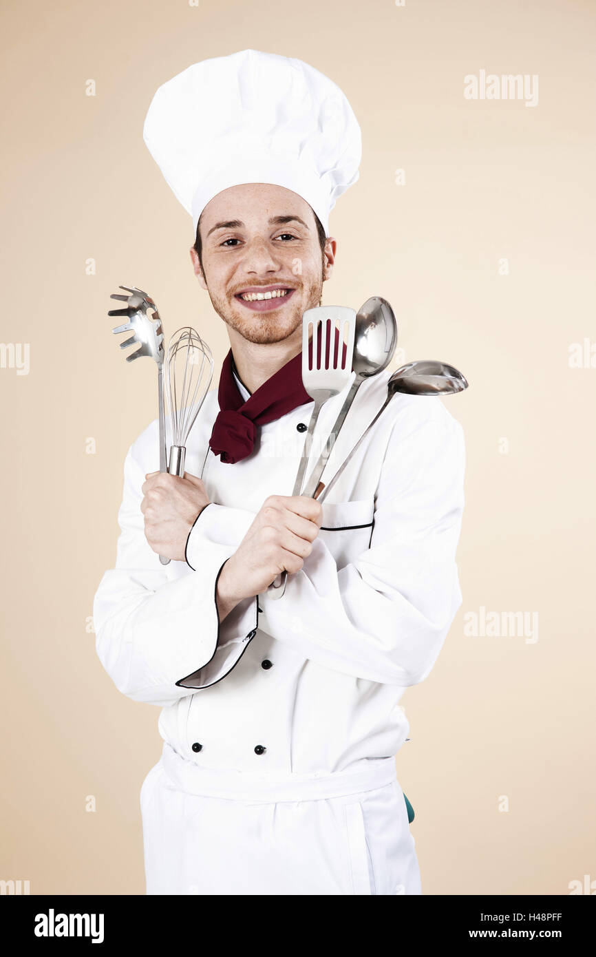 Cook, looking at camera, culinary implements, show, half portrait Stock ...