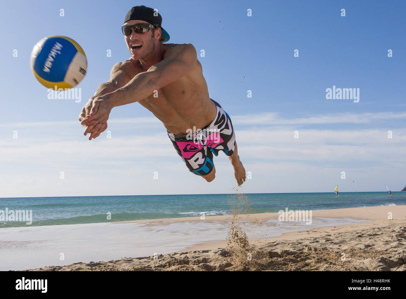 Beach volleyball player, digging on the beach Stock Photo - Alamy