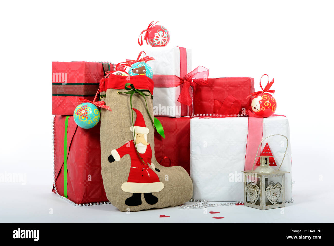 the Christmas gift boxes with boot of Santa Claus Stock Photo - Alamy