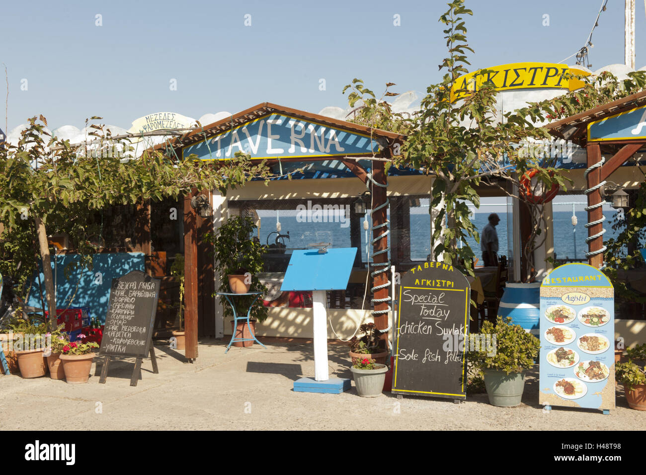 Greece, Crete, Sisi to the east Malia, taverns on the beach Stock Photo ...