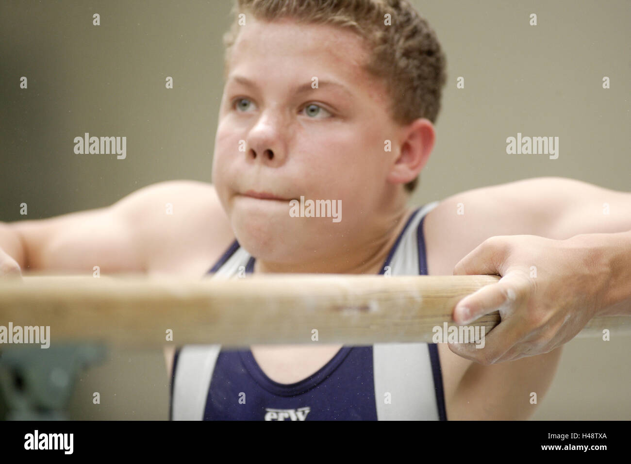 Young person, ingot, do gymnastics, medium close-up, detail Stock Photo ...