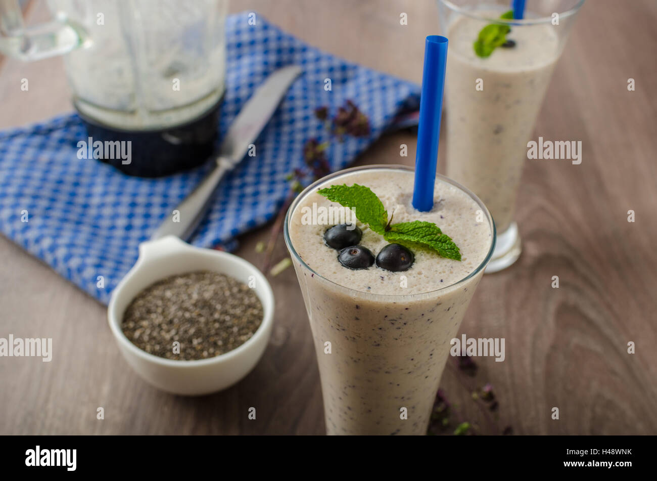 Blueberries milk shake with orange juice on the bottom of glass Stock ...