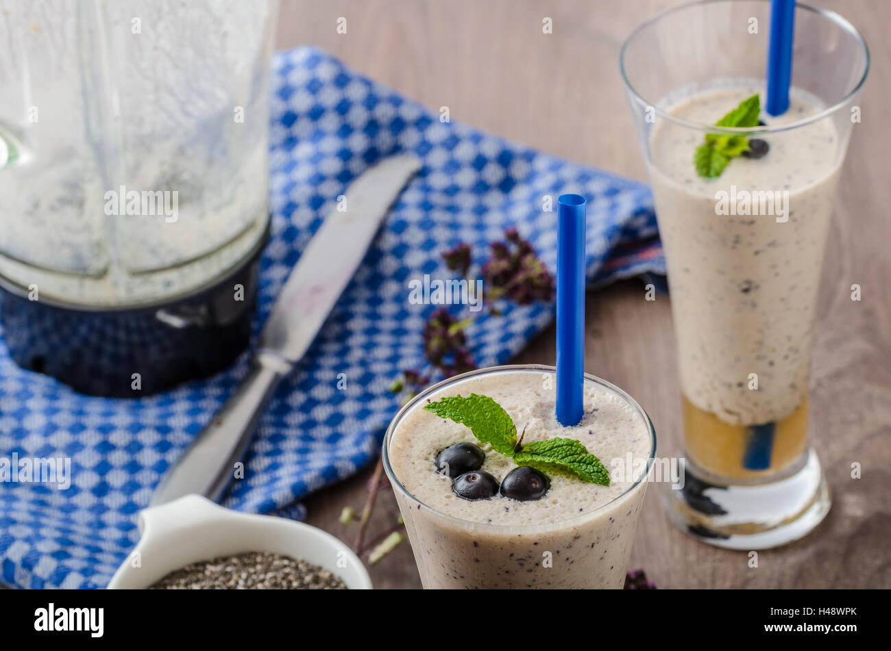Blueberries milk shake with orange juice on the bottom of glass Stock ...