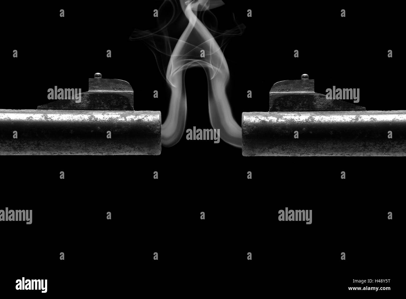 smoking pistol with smoke after the shot Stock Photo - Alamy