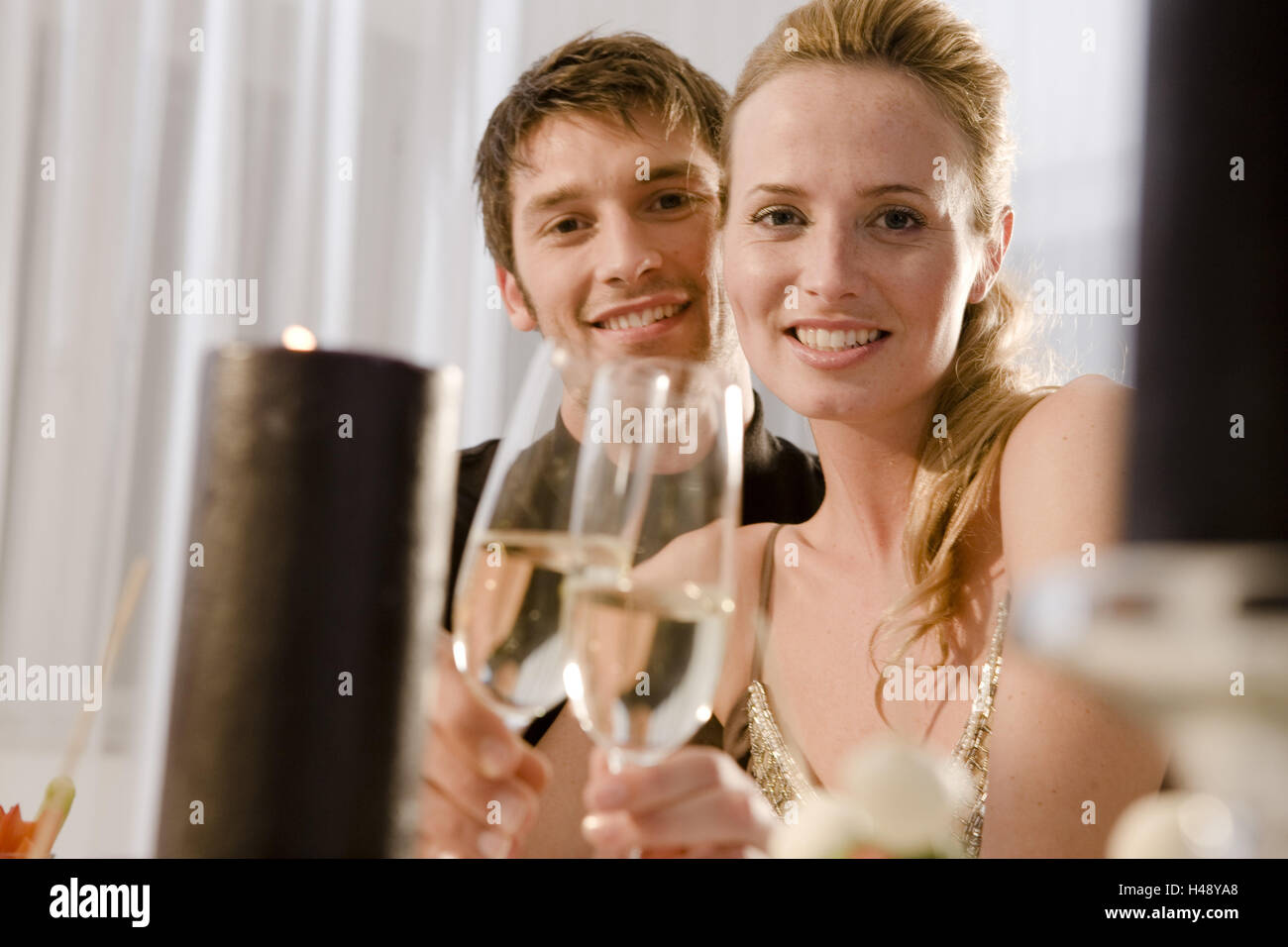 Couple, young, champagne glasses, chink glasses, candles, detail ...