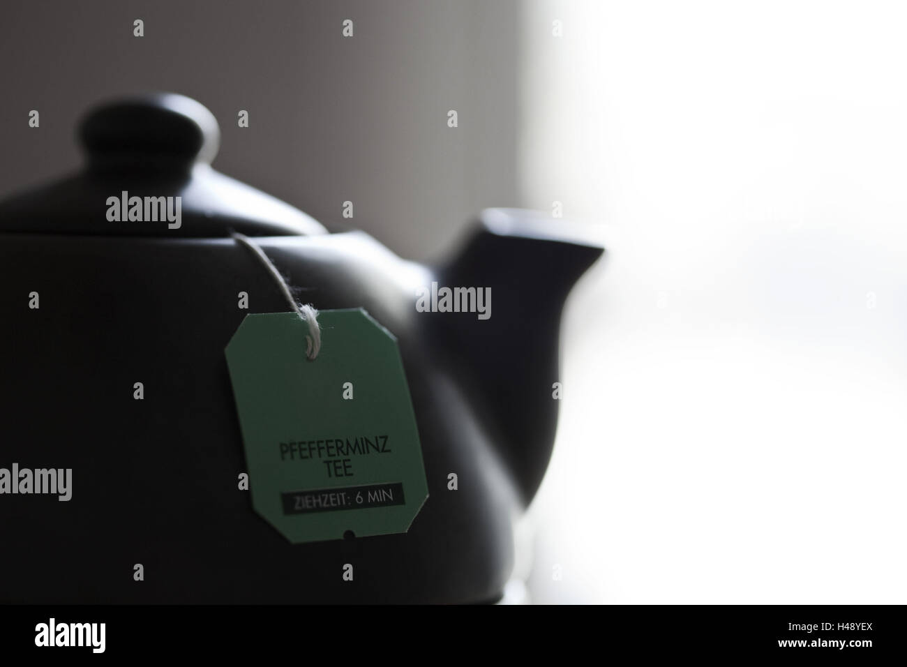 Teapot with peppermint tea, close up Stock Photo - Alamy