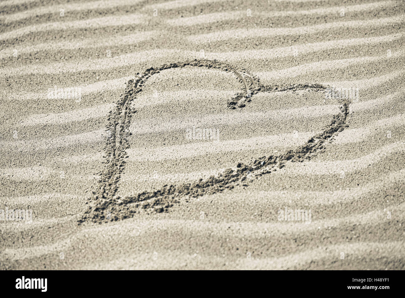 Heart painted in sand Stock Photo - Alamy