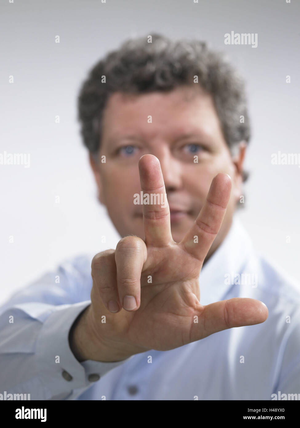 Three finger hand gesture sign hi-res stock photography and images - Alamy
