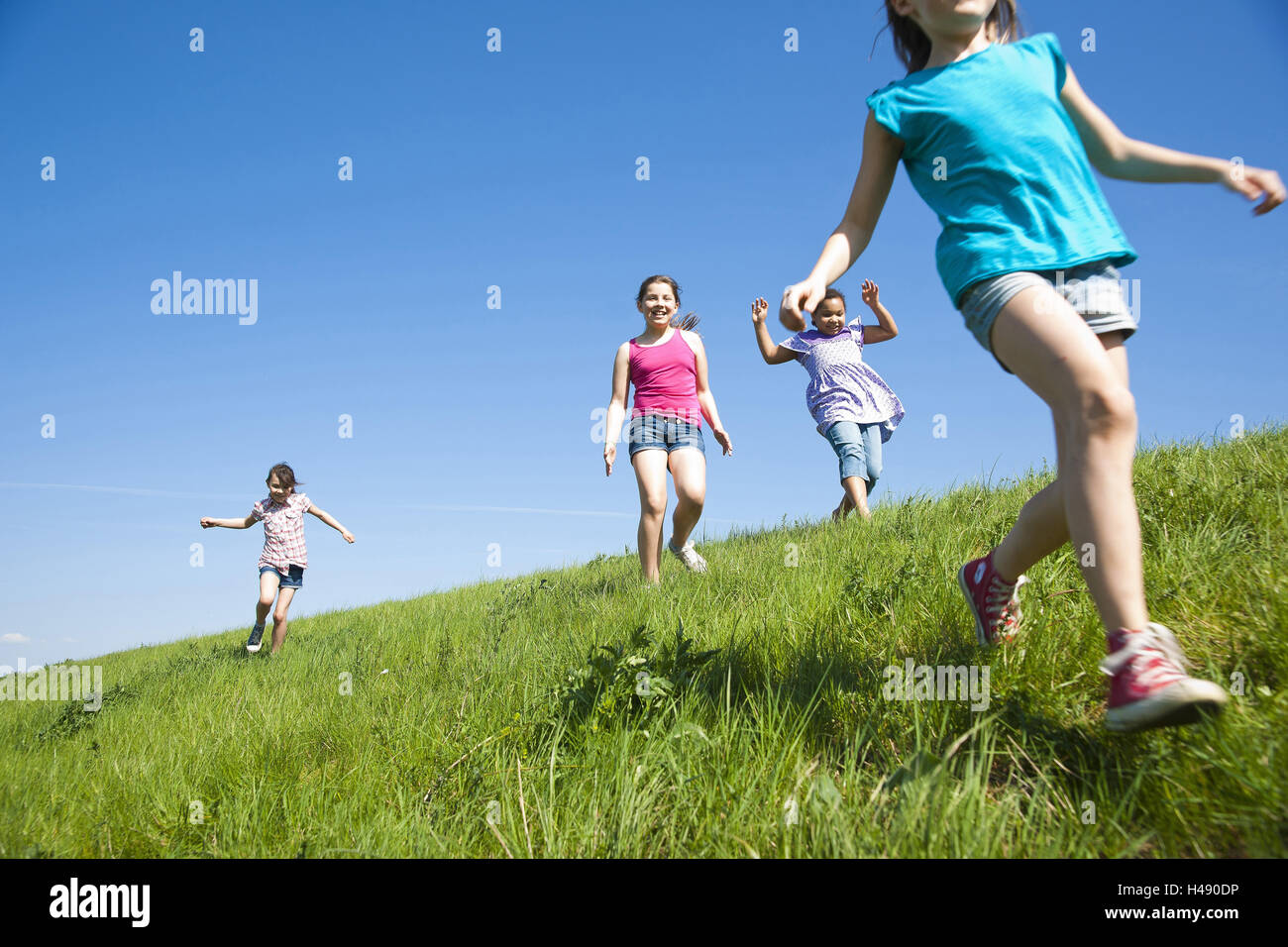 Children running through meadow hi-res stock photography and images - Alamy