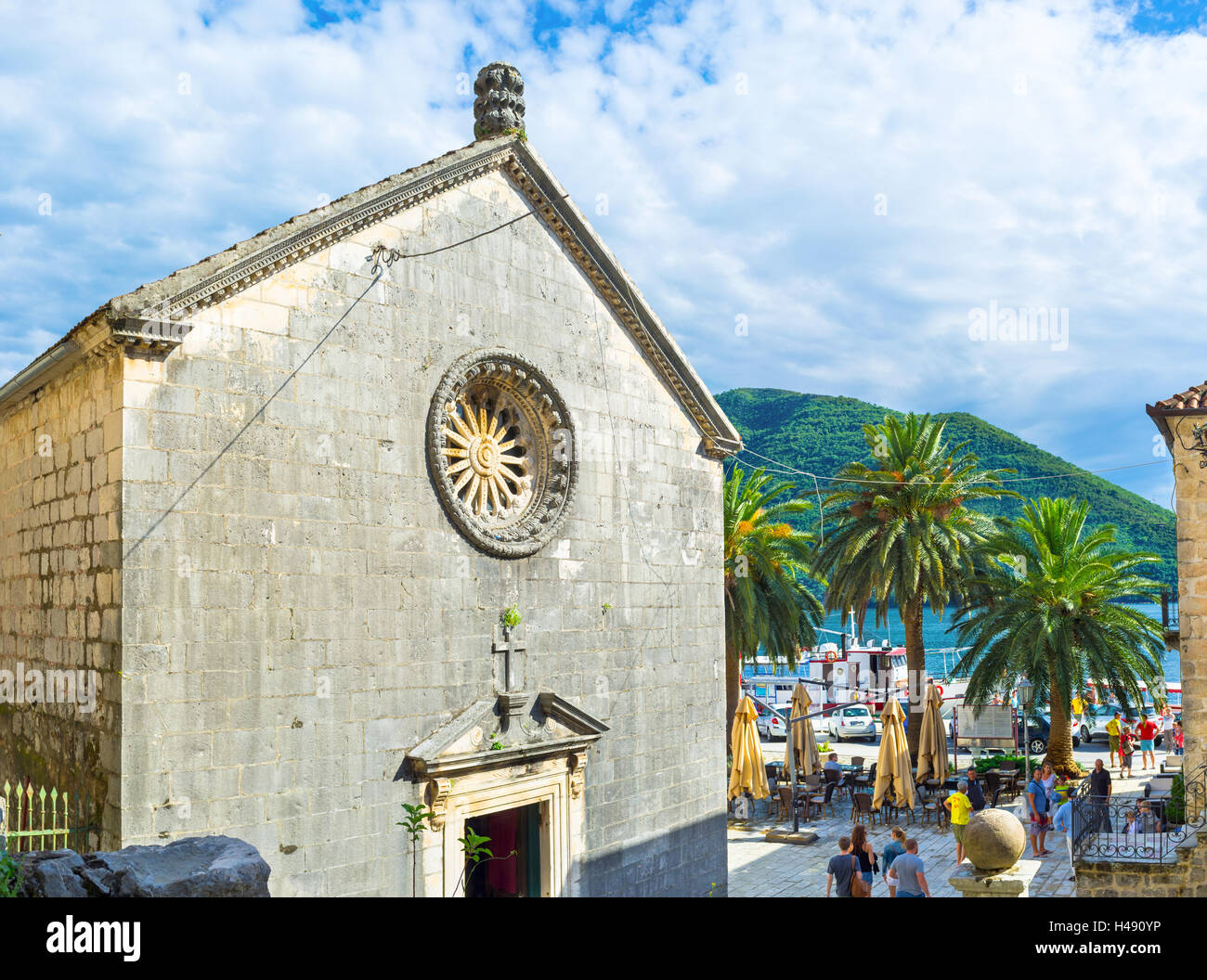 The St Nicholas Church located on main town square with the harbor on ...