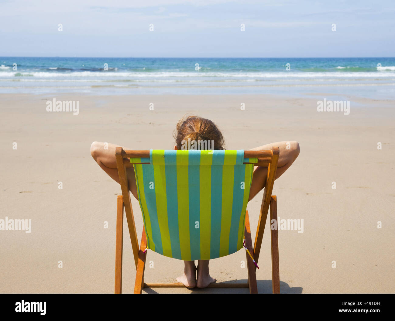 Woman, sun bench, beach Stock Photo - Alamy