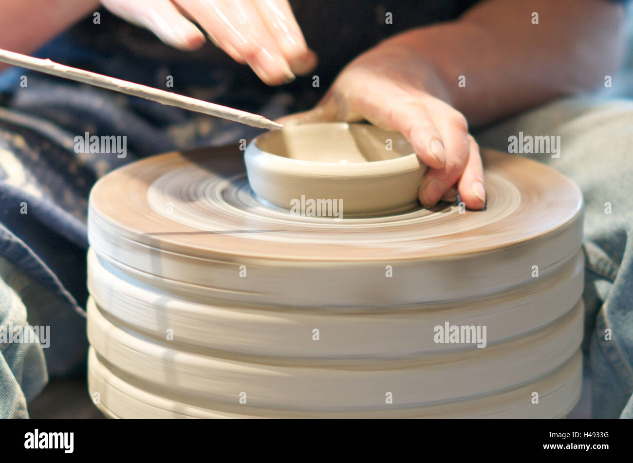 Potter, potter's wheel with tone, medium close-up, detail Stock Photo ...
