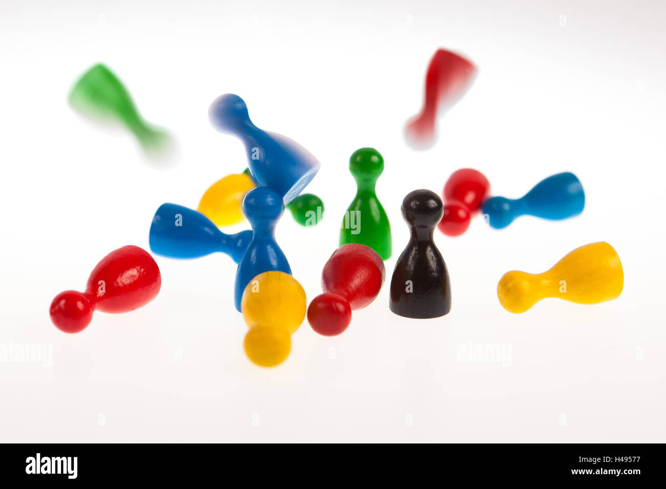 Falling playing piece symbolising crash, chaos, mess Stock Photo - Alamy