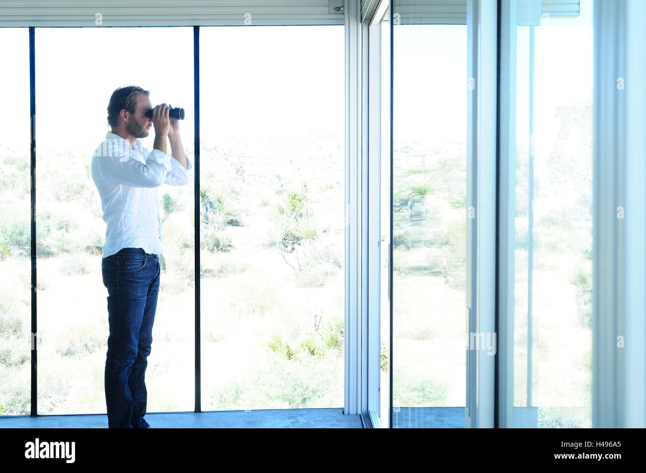 Man, binoculars, view, side view Stock Photo - Alamy