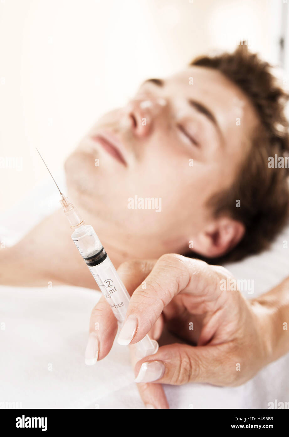 young man getting an injection Stock Photo - Alamy