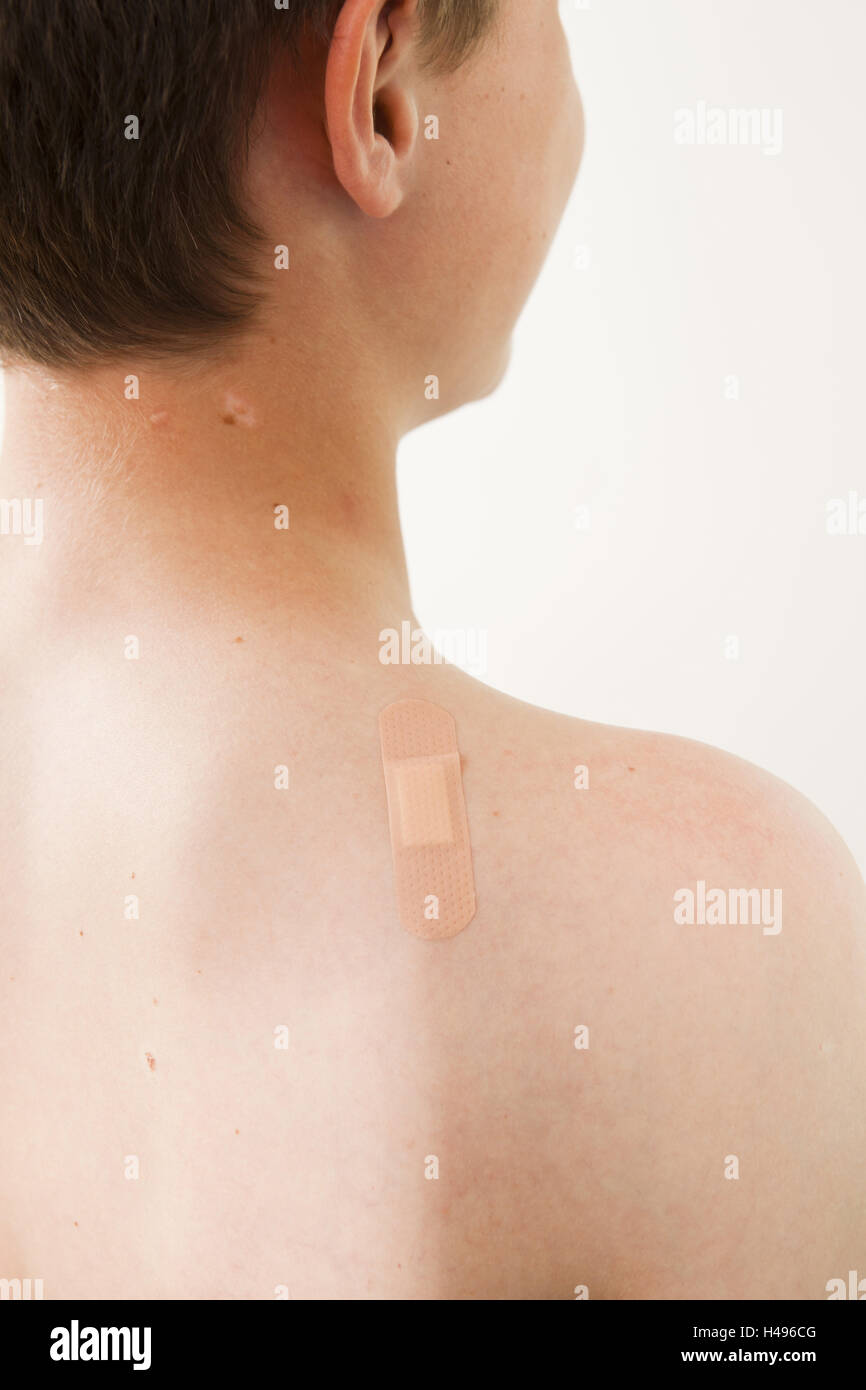 Teenager with a plaster on the shoulder Stock Photo - Alamy