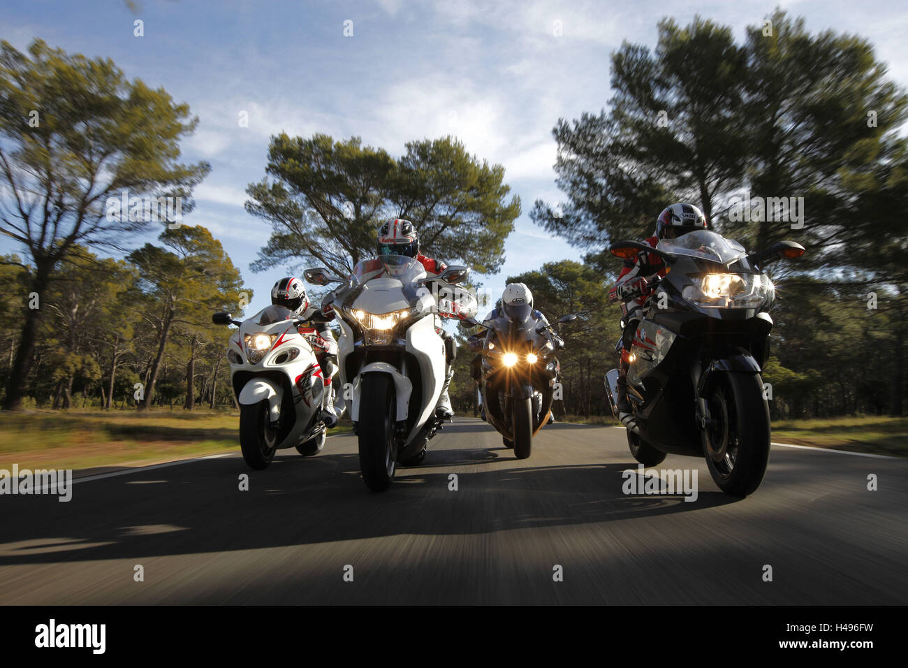 four motorcyclists, motorcycle group, sports bikes, moving, from the ...