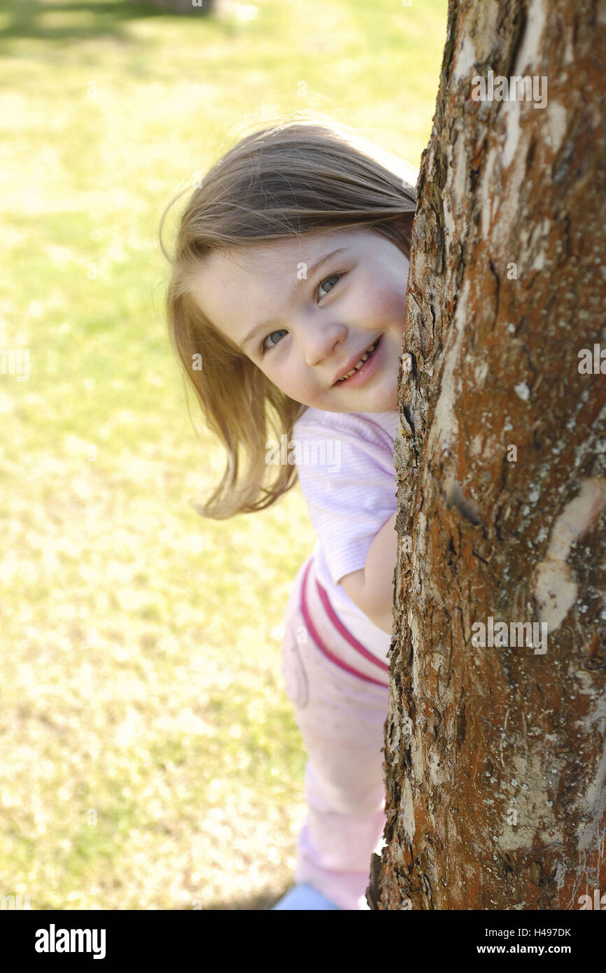 Girls, trunk, hide, play Stock Photo - Alamy