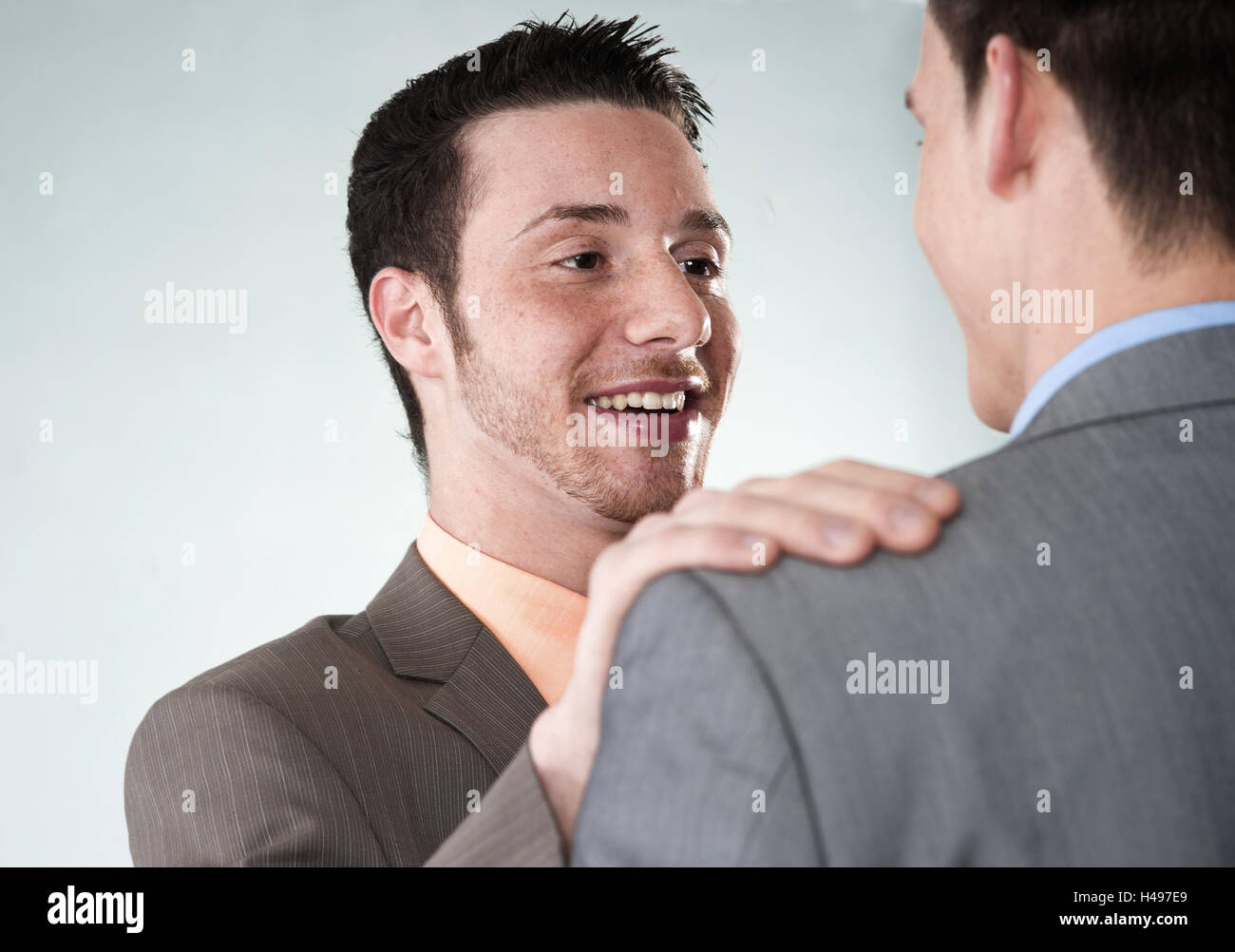 Two Jung's entrepreneurs are confronted laughing Stock Photo - Alamy