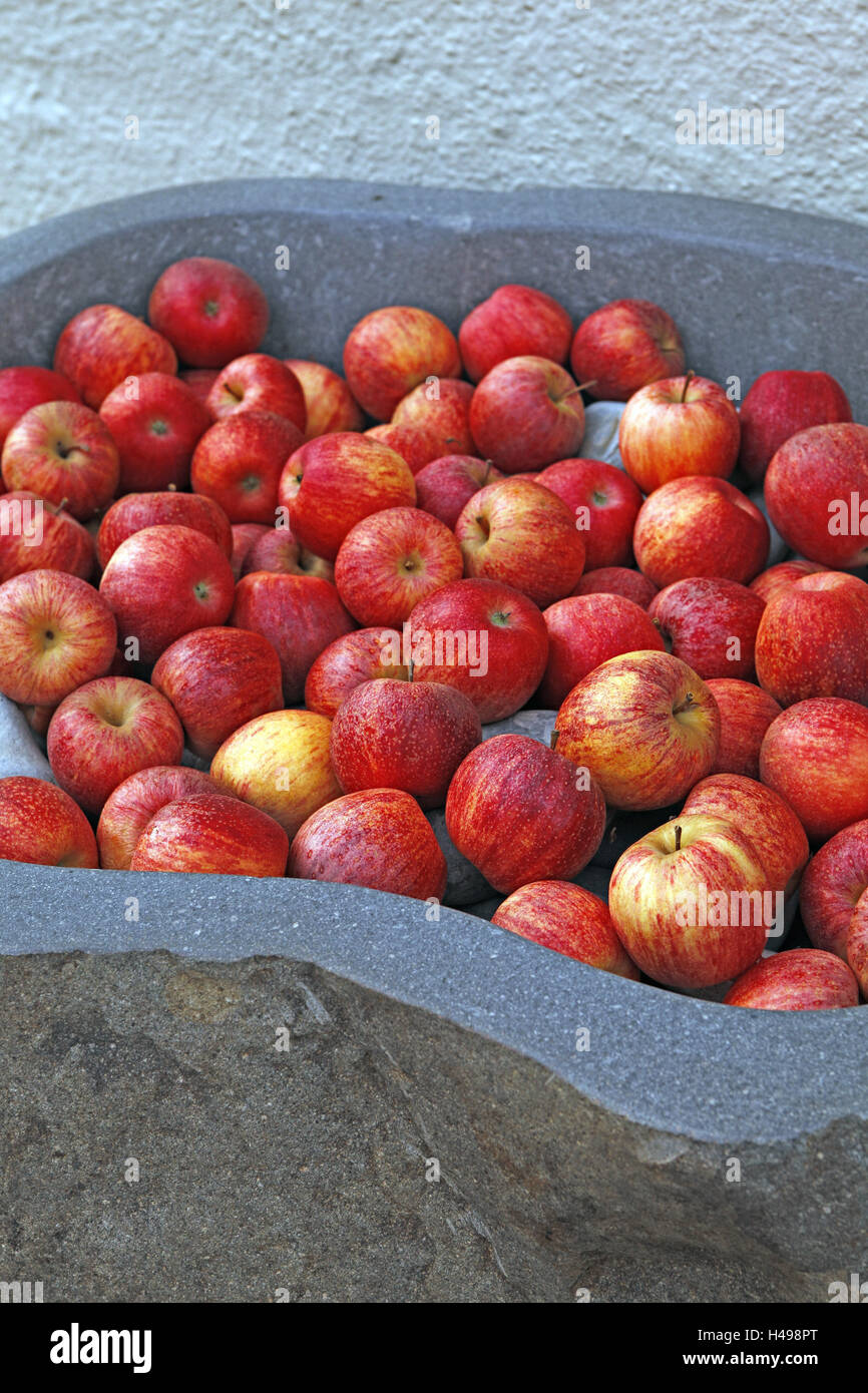 red apples in stone trough Stock Photo - Alamy