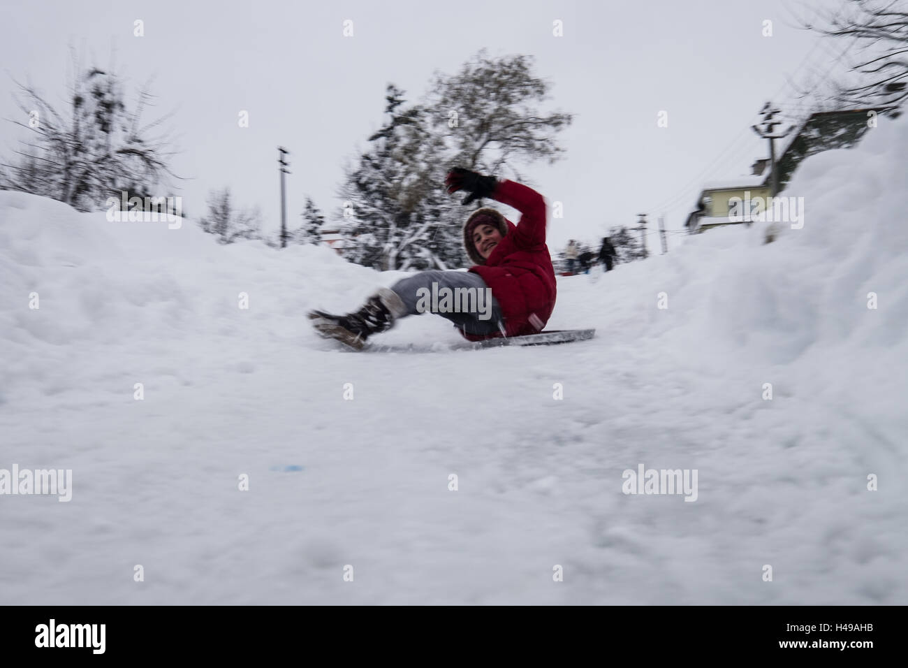 People sliding on snow hi-res stock photography and images - Alamy