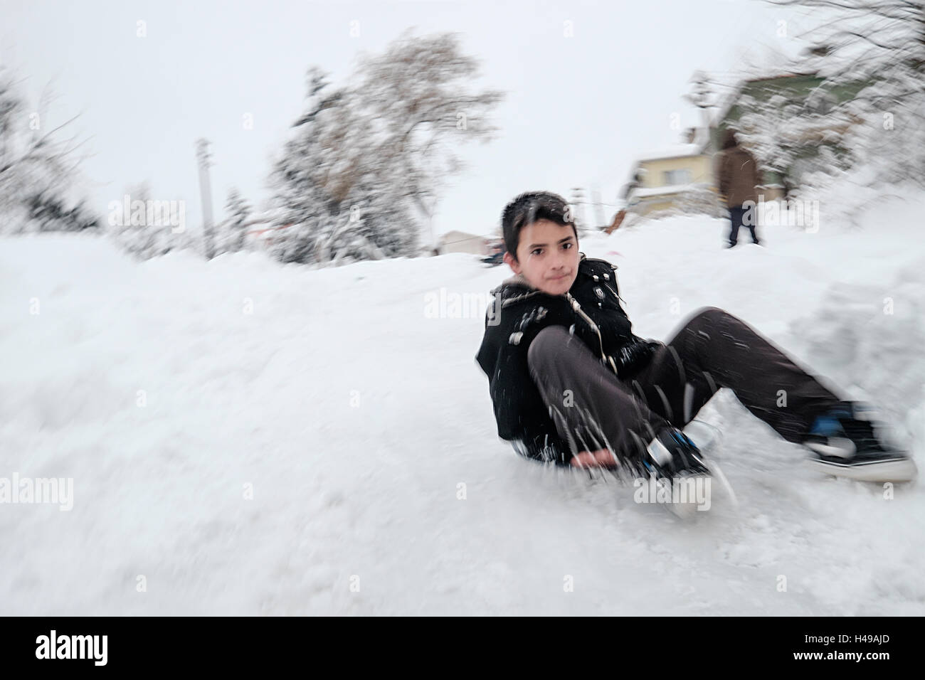 People sliding on snow hi-res stock photography and images - Alamy