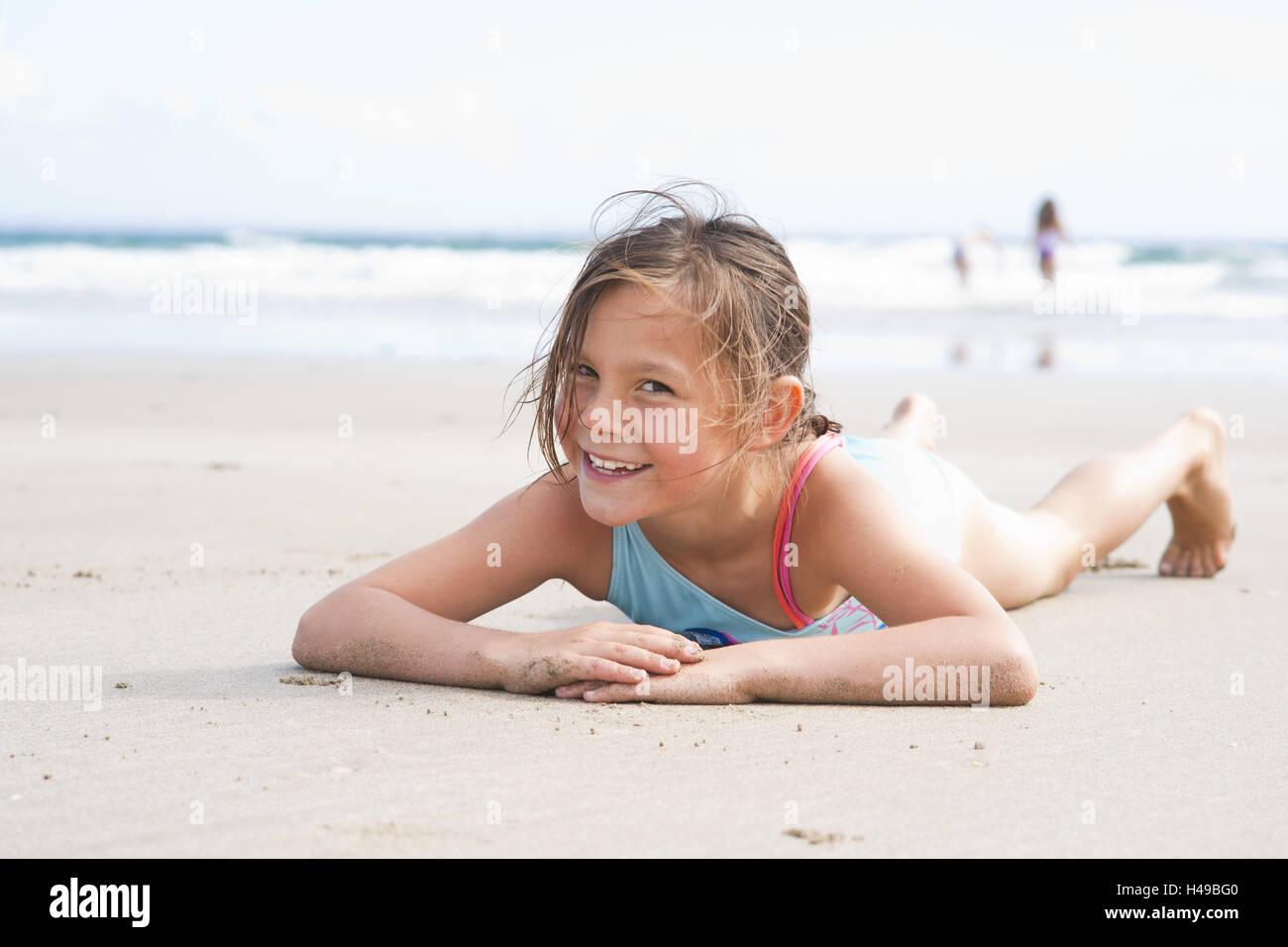 Girl lies on the beach Stock Photo - Alamy Girl lies on the beach Stock Photo - Alamy
