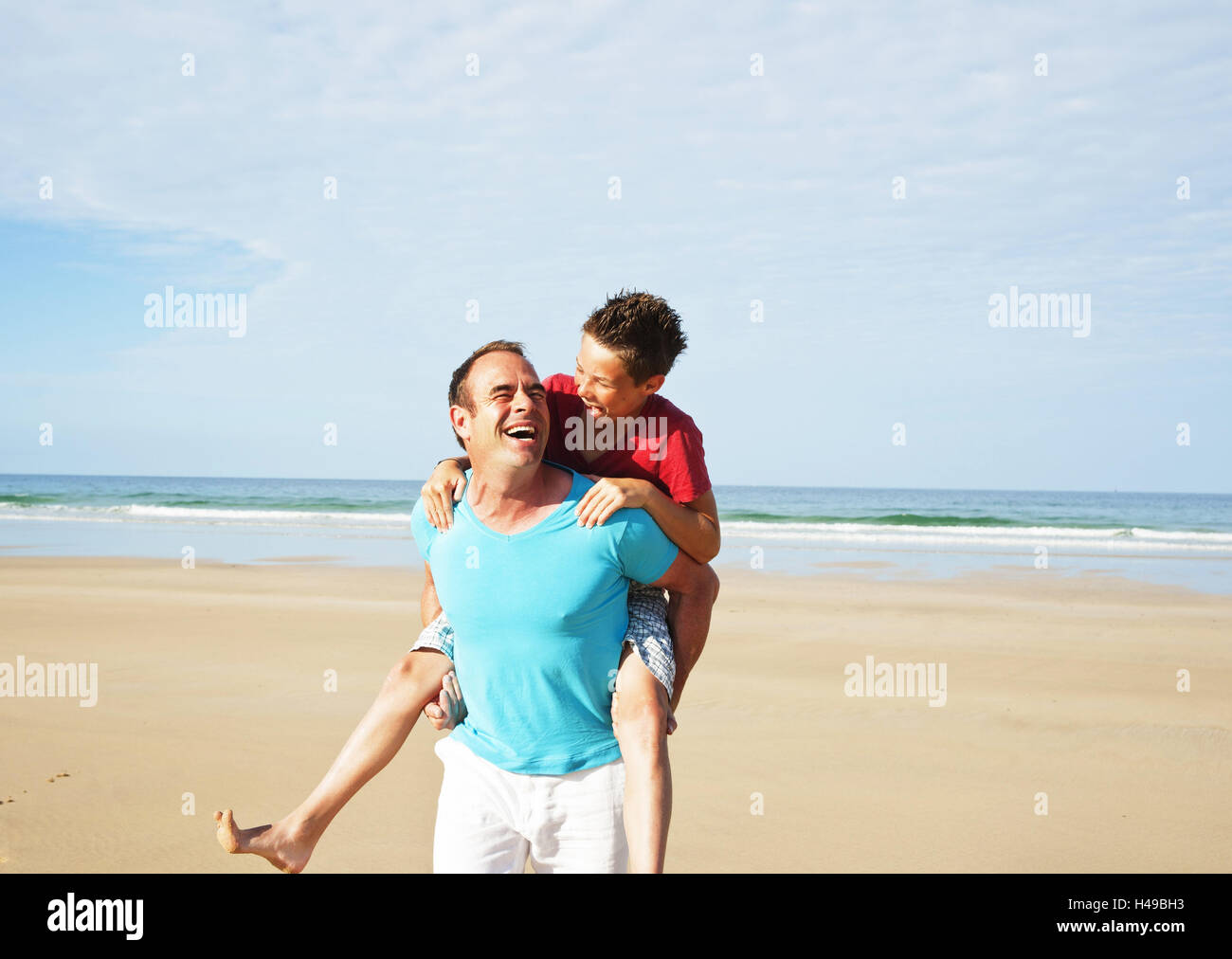 Father and son on the beach Stock Photo - Alamy
