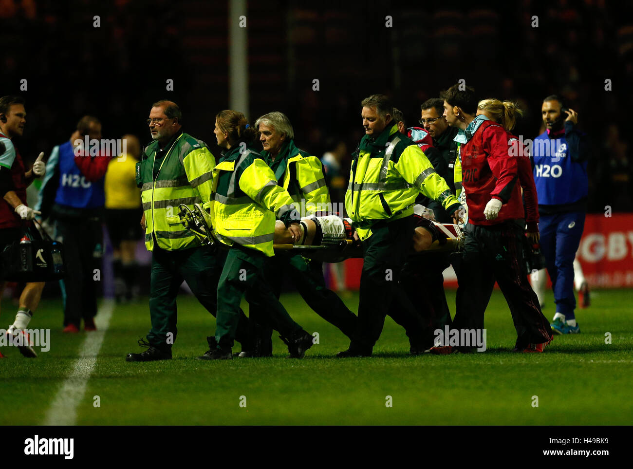 Harlequins' George Merrick is stretchered off during the European ...