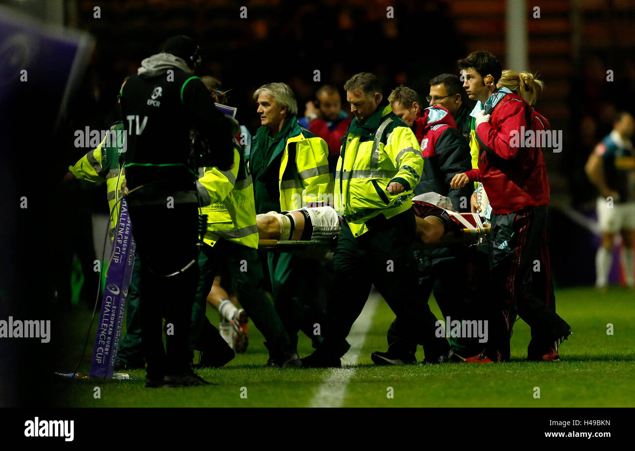Harlequins' George Merrick is stretchered off during the European ...