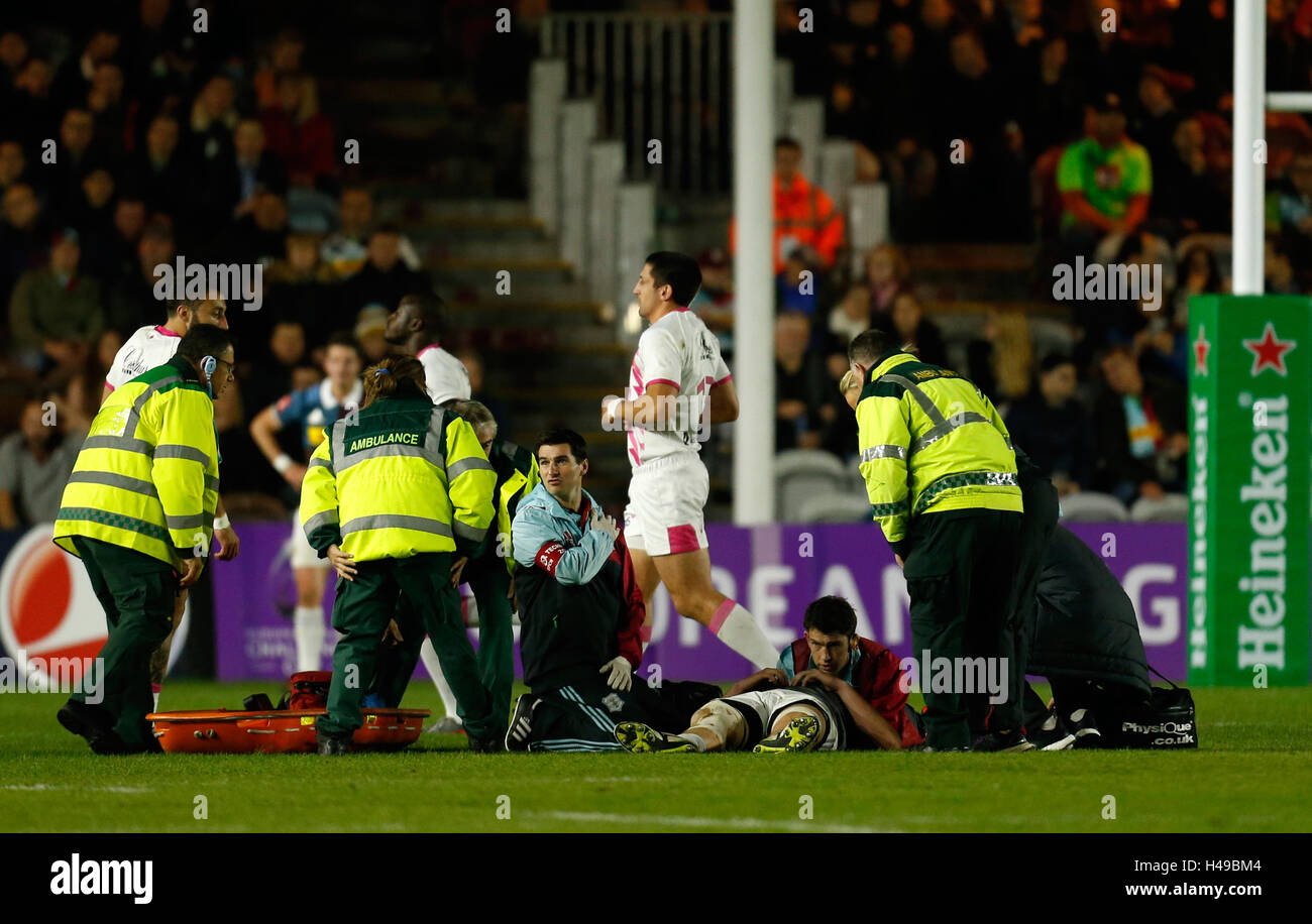 Harlequins' George Merrick receives treament prior to being stretchered ...