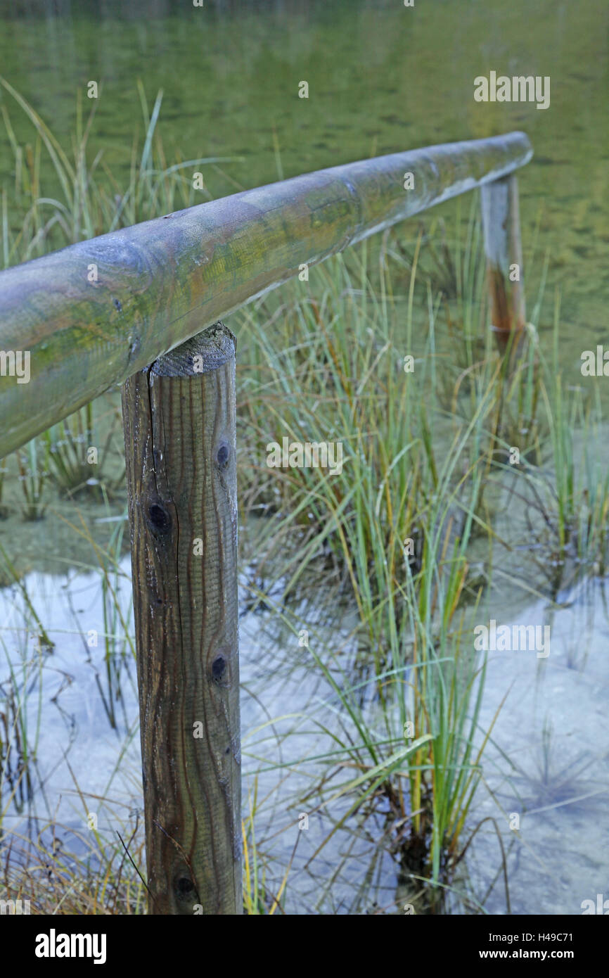 Wooden railing, grass, lake Stock Photo - Alamy
