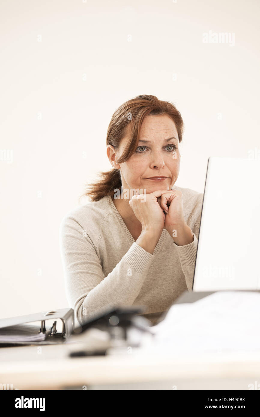 Woman sits frustrated before the computer Stock Photo - Alamy