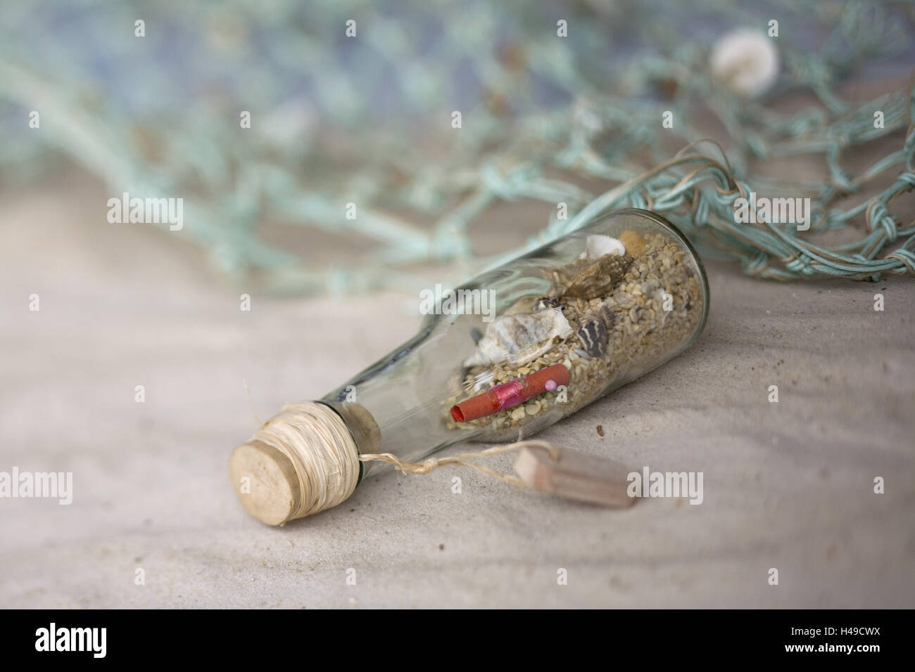 Message in a bottle in sand Stock Photo - Alamy