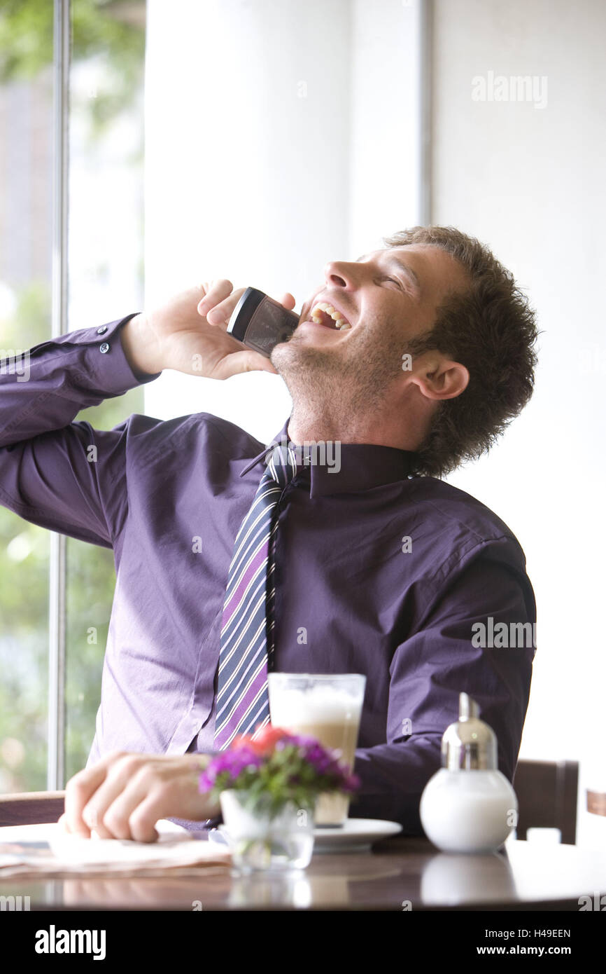 Cafe, man, young, laughing, phones, mobile phone, happy, portrait Stock ...