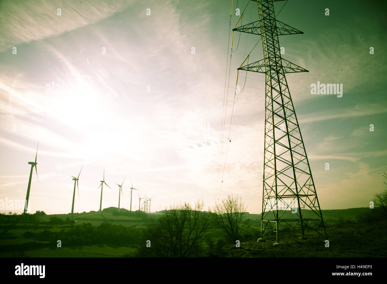 Power pole, wind turbines, backlight Stock Photo - Alamy