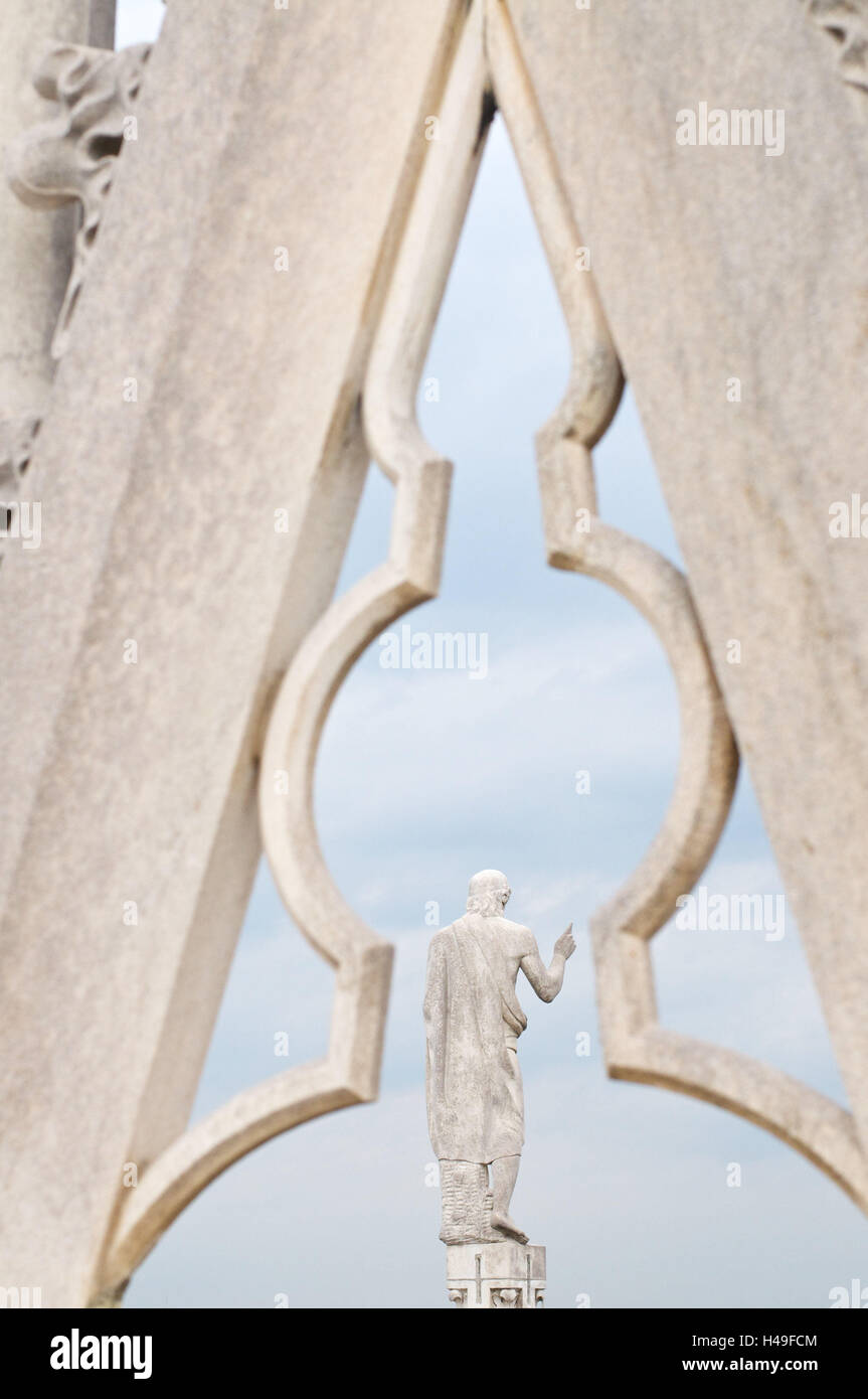 Statue of a saint, clouds, praying Stock Photo - Alamy