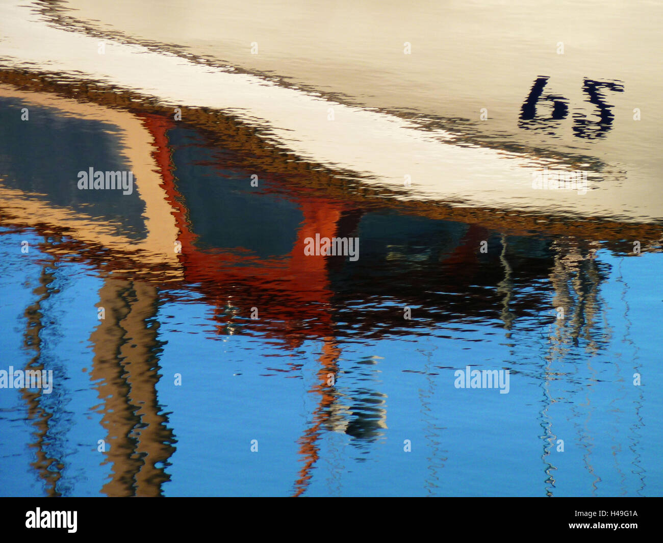 Reflection of a boat in the water Stock Photo - Alamy