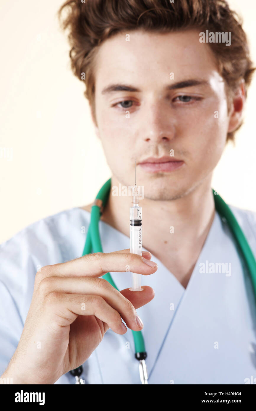 Portrait of a young doctor with injection Stock Photo - Alamy