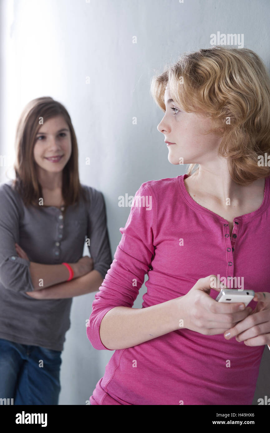 Two girls with mobile phone Stock Photo - Alamy