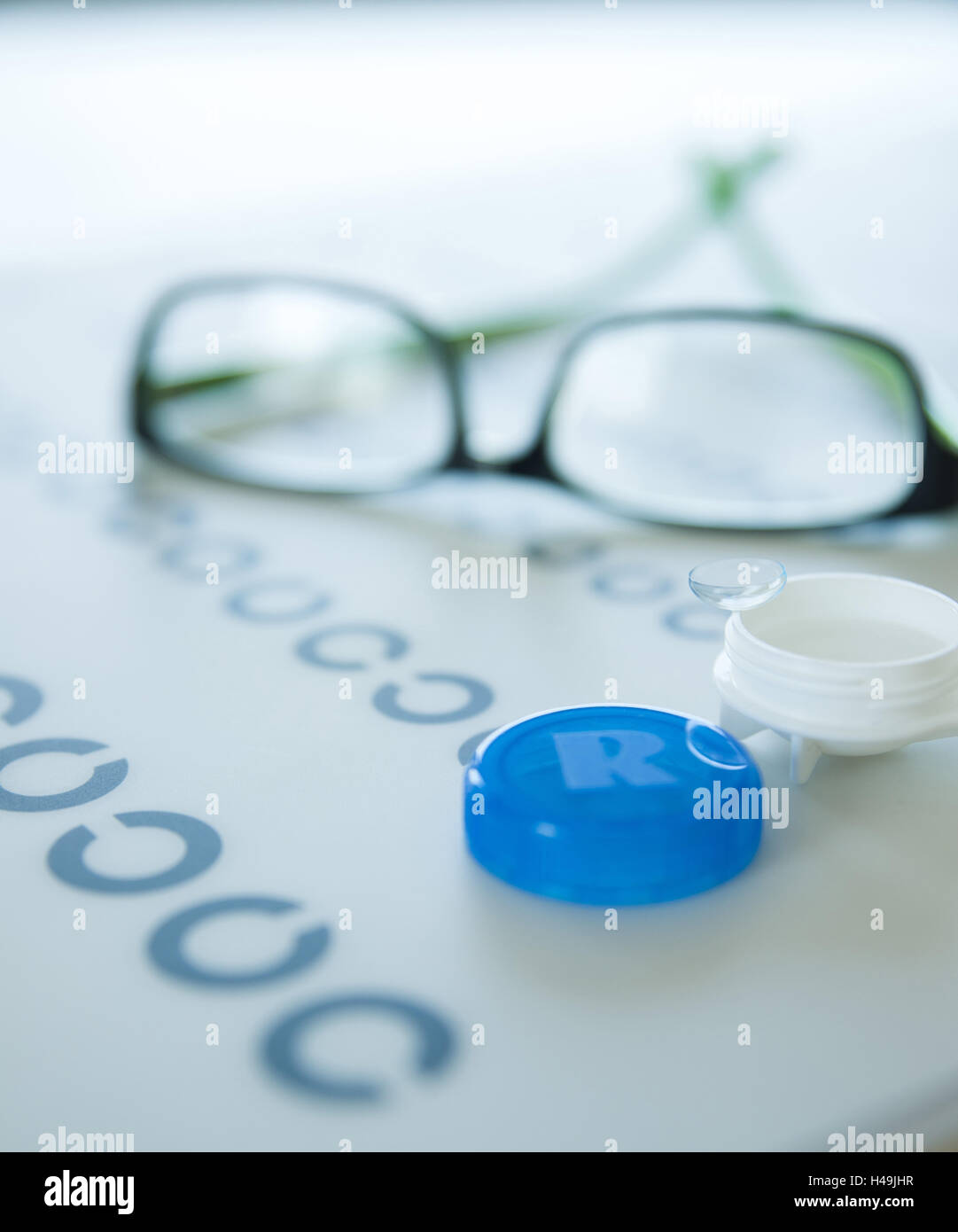 Contact lenses and glasses on a visual test Stock Photo - Alamy