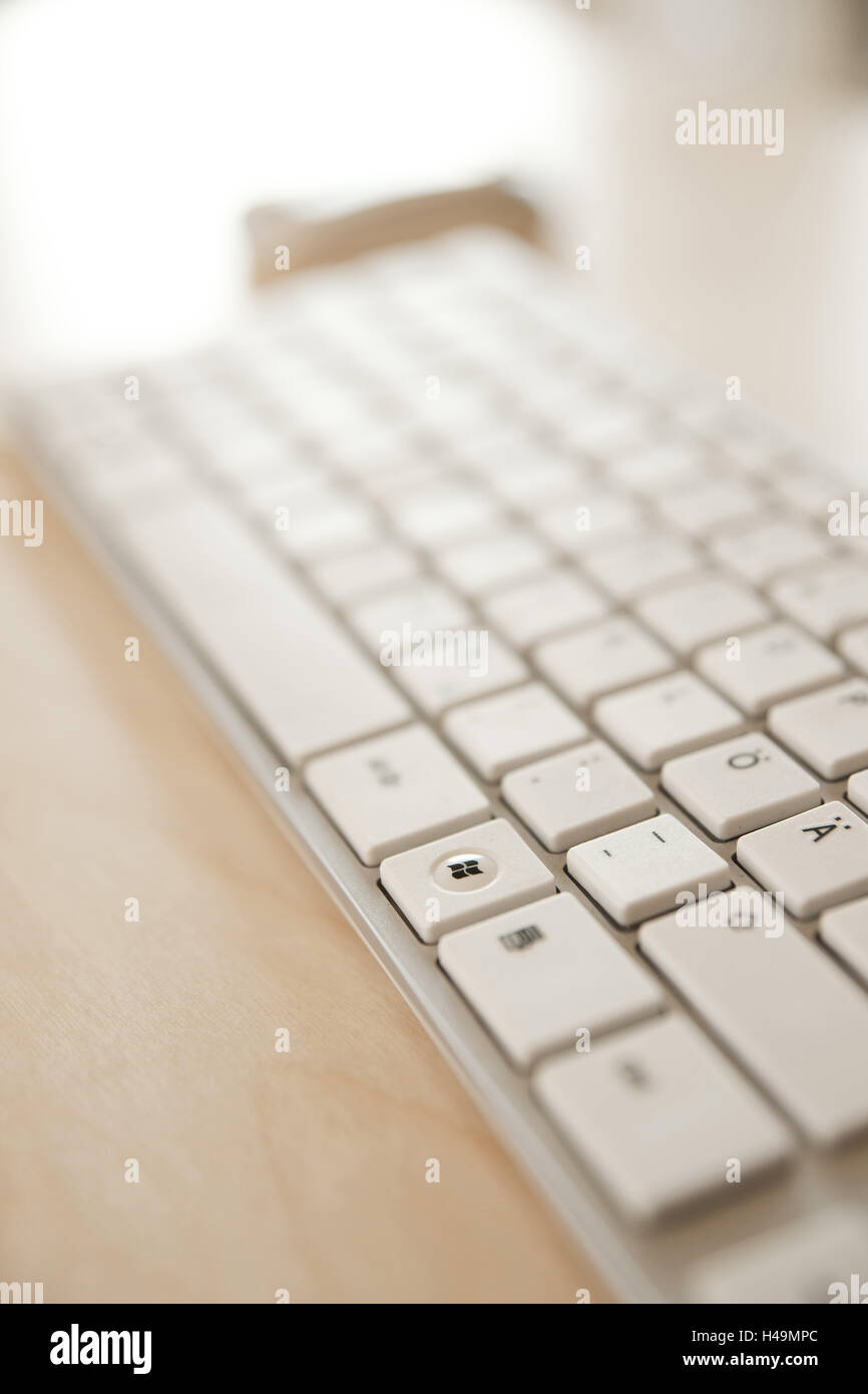 Computer keyboard on table, medium close-up Stock Photo - Alamy