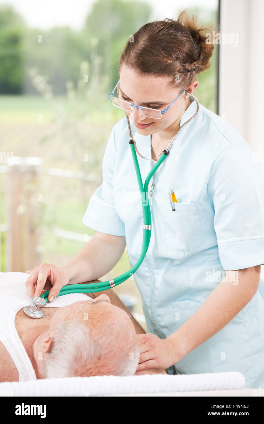 Boss is examined by young doctor Stock Photo - Alamy