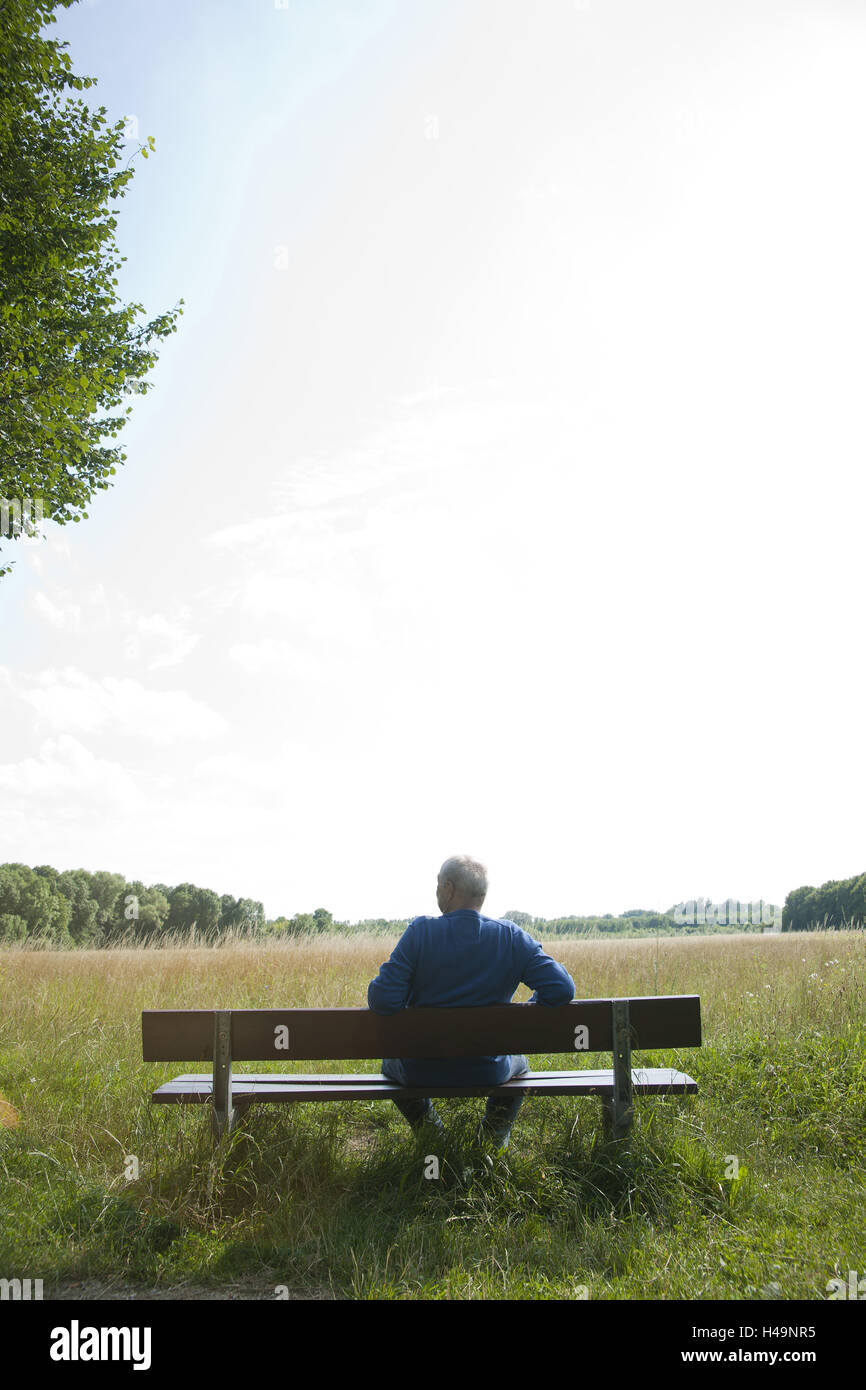 Senior sitting alone on a bench Stock Photo - Alamy