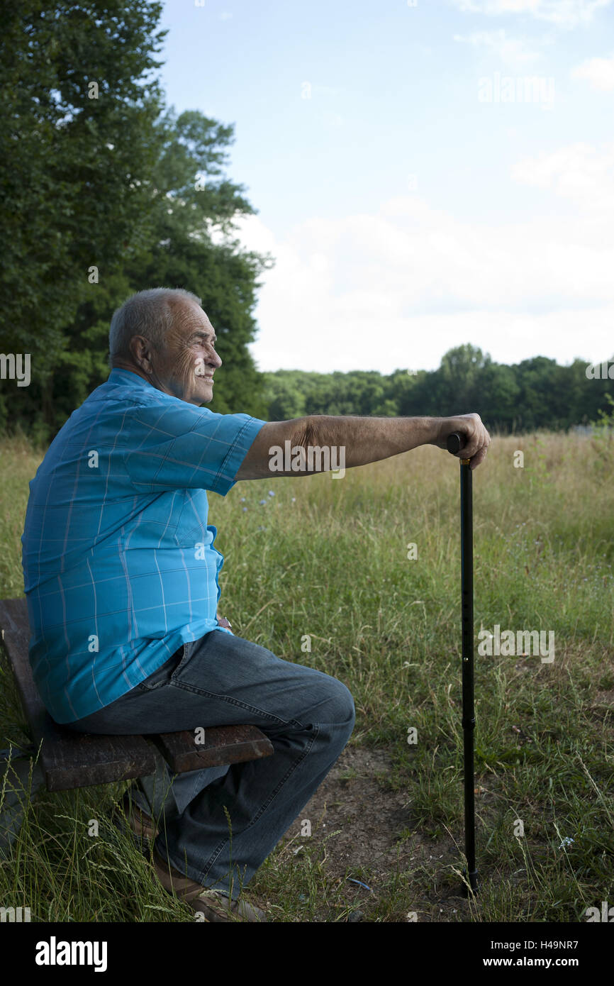 Senior sitting alone on a bench Stock Photo - Alamy