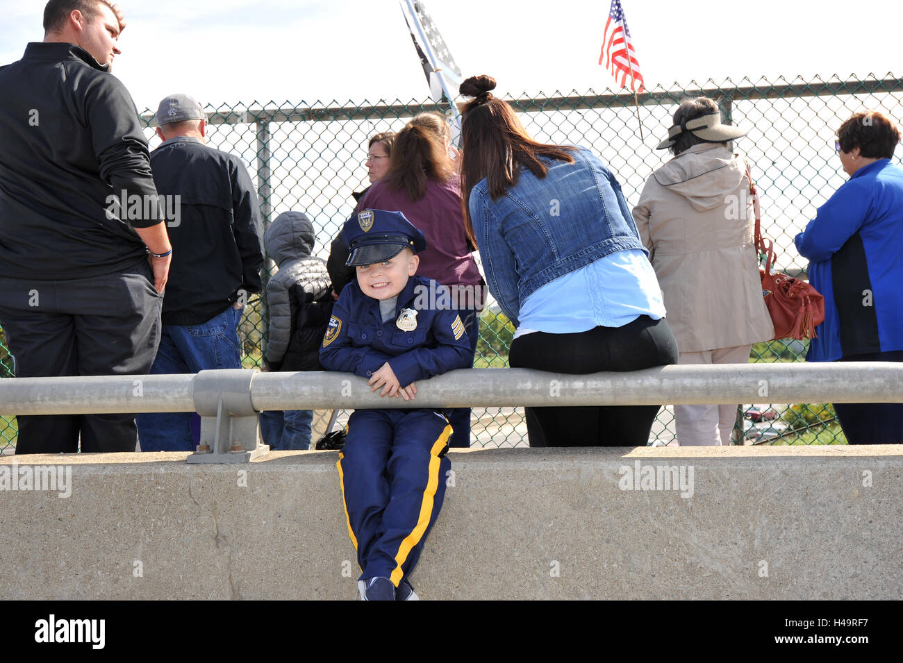 Crowd uniform smiling communication hi-res stock photography and images ...