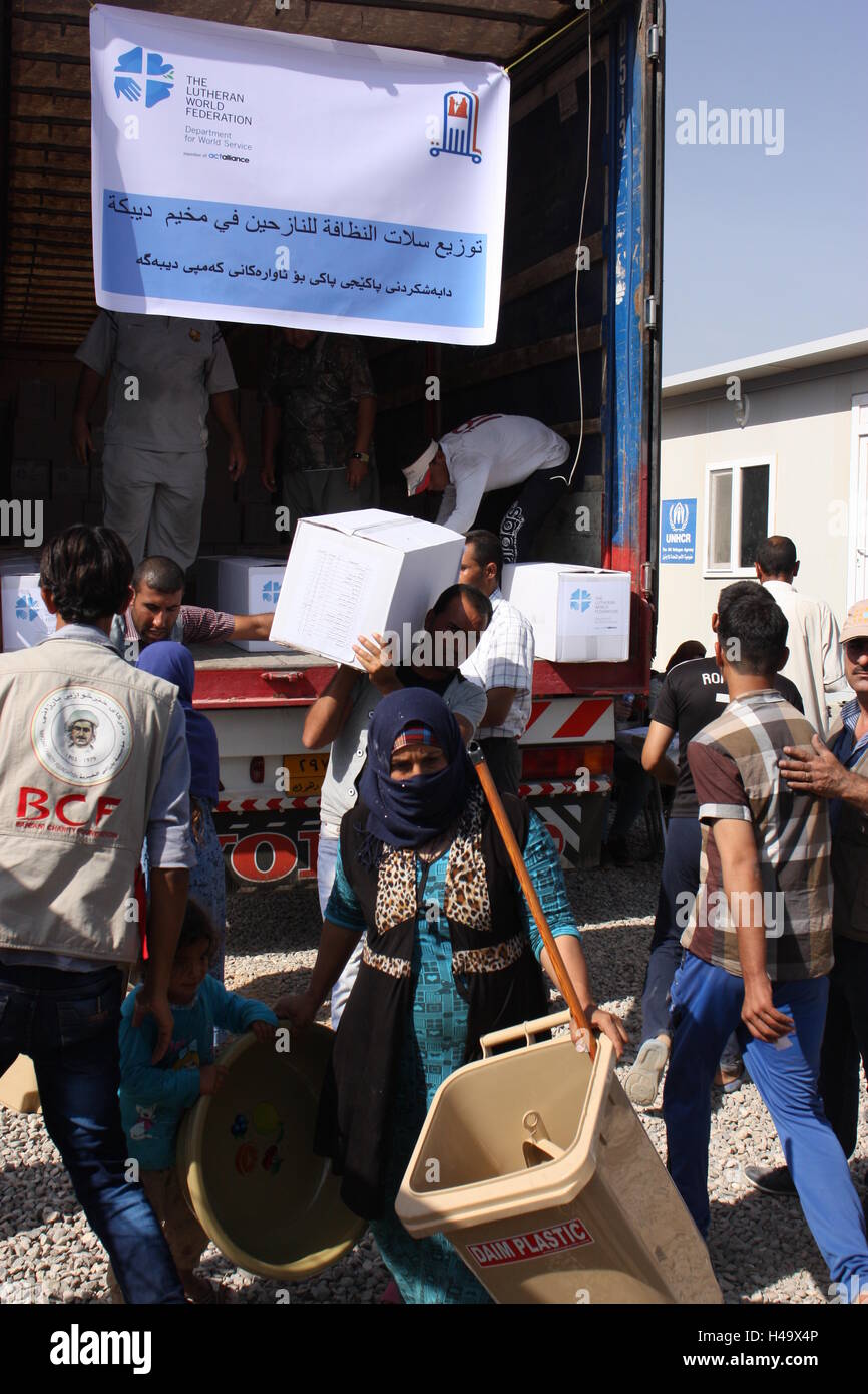 Relief goods being handed out in the refugee camp Debaga in Northern ...